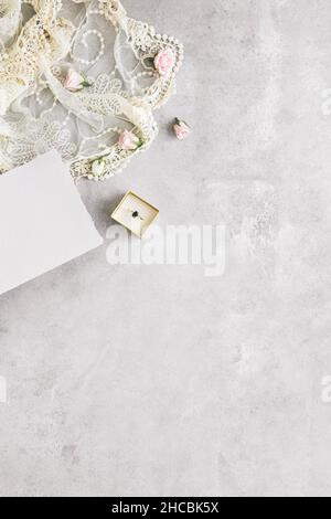 Golden wedding rings, in the background the bride's bouquet of multi ...