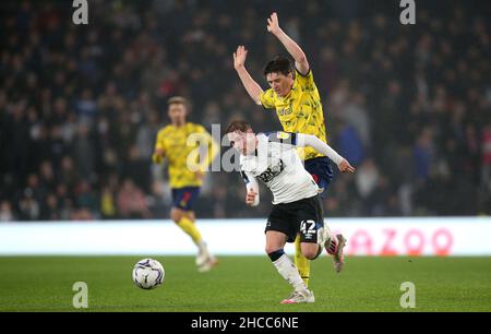 Derby County's Liam Thompson (left) and Norwich City's Marcelino Nunez ...