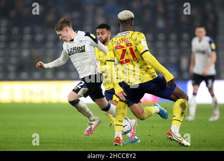 Derby County's Liam Thompson (left) and Norwich City's Lewis Dobbin ...