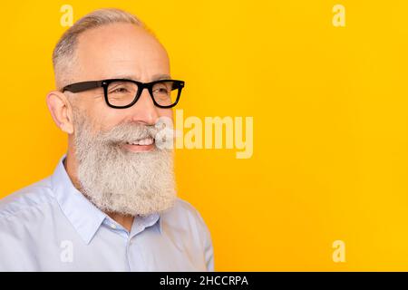 Photo of happy charming old man hold hand waist use laptop smile work ...