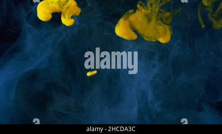 Ink water. Spreading paint clouds. Multicolor dye mixing. Art ...