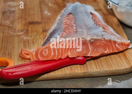 Chef is skinning salmon fillets for cooking Stock Photo - Alamy