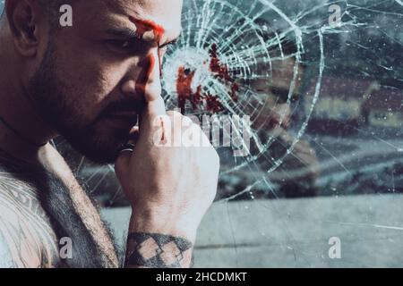 Brutal man, serious bloody face of male model, concept of men power and ...