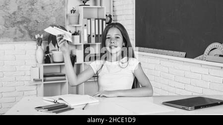 concept of travel. child pupil sit at table. girl is college student ...
