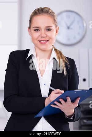 Secretary writing instructions Stock Photo - Alamy