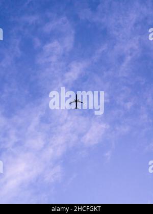 A low angle shot of an airplane in flight Stock Photo - Alamy