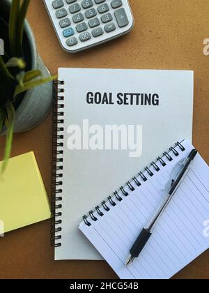 To succeed, work hard, never give up. a young businesswoman working on ...