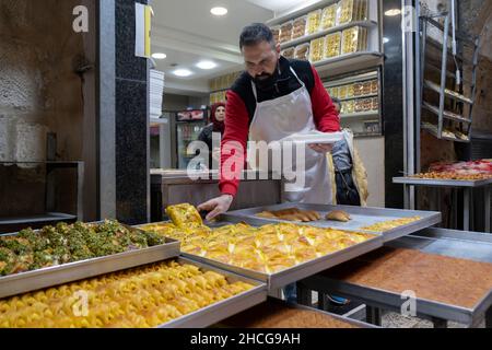 Palestinian street food vendor sells instant noodles to school children ...