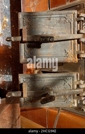 Traditional coal-fired heating furnace with decorative doors Stock ...