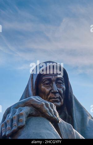Close up, detail of the wailing, grieving mother statue. At Memorial ...