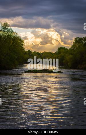 A scenic view of the flowing river Hope against blue cloudy sky on a ...