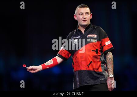 Nathan Aspinall reacts during his match against Rob Cross during the Darts 2025 BetMGM Premier ...