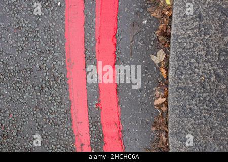 Double red lines / road markings Stock Photo - Alamy