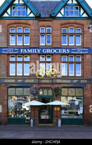 Shops in Market Square in Penrith town centre in Cumbria, ENgland, UK ...