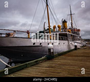 Survey vessel, research vessel patrol boat sailing in bright blue ...