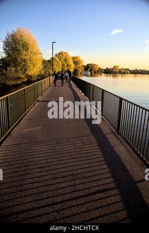Walkway on the water by the riverside at sunset Stock Photo - Alamy