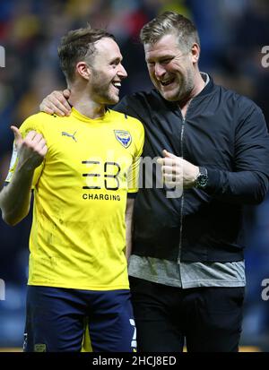 Oxford United's Sam Long (left) scores Barnsley's first goal of the ...