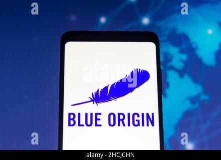In this photo illustration, the Blue Origin logo is displayed on a ...