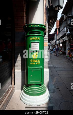 Old Chinese Postman in Traditional attire Stock Photo - Alamy