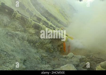 Ceramic pipes used for sulfur mining inside the crater of Kawah Ijen ...