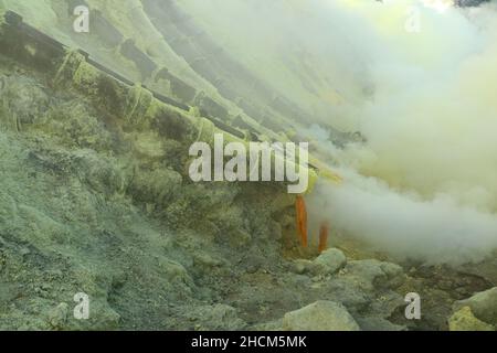 Ceramic pipes used for sulfur mining inside the crater of Kawah Ijen ...