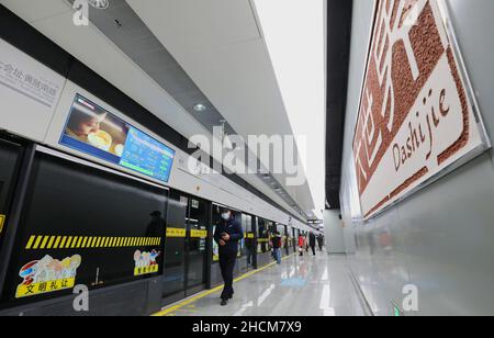 Shanghai. 30th Dec, 2021. Passengers look at a map at Lujiazui Station ...