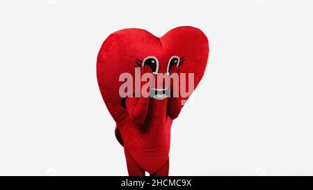 person in heart costume touching cartoon eyes isolated on yellow Stock ...
