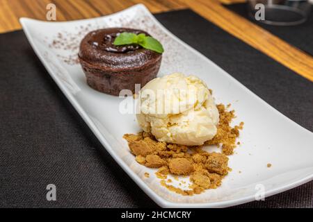 Closeup shot of chocolate fondant with vanilla ice-cream Stock Photo ...