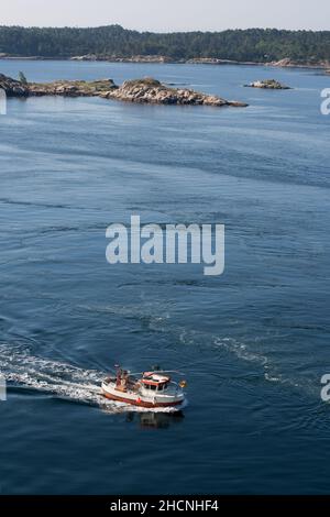 Norwegian fishing vessel returning to harbour. Kristiansand, Norway ...