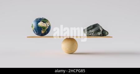 wooden scale balancing big Earth ball and plastic bottle. Concept of ...