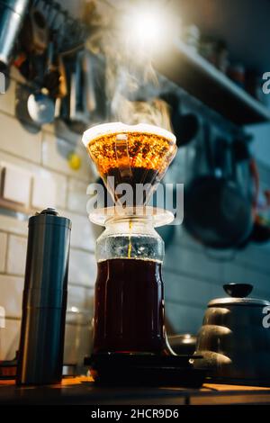 Coffee roaster in a coffeehouse, vertical photo of industrial roastery ...