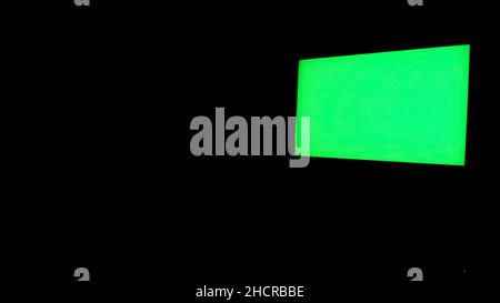 Glowing TV screen at night mockup in classic decoration living room ...