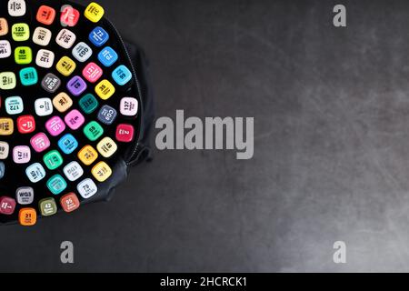 Professional sketching markers of different colors in a bag on a dark ...