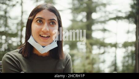 Indian female with a mask in the forest on a sunny day Stock Photo - Alamy