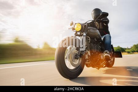 High power motorcycle chopper on the country road riding. having fun ...