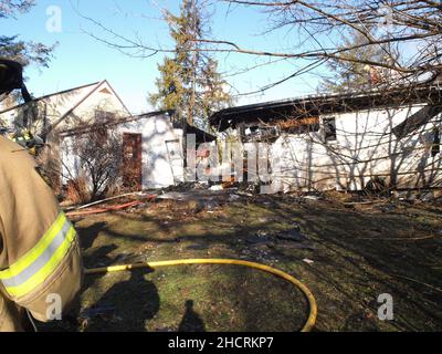 Aftermath of house fire, overhaul operations Stock Photo - Alamy