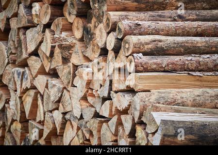 A big pile of wood in a forest road Stock Photo - Alamy