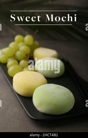 Delicious mochi on grey table, space for text. Traditional Japanese ...