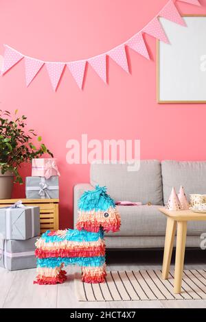 Interior of stylish room with Mexican pinata decorated for Birthday ...