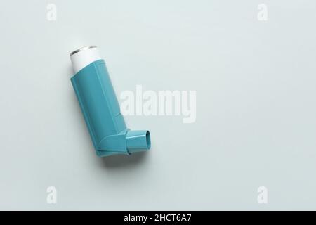 Asthma inhaler on light grey background, space for text Stock Photo - Alamy
