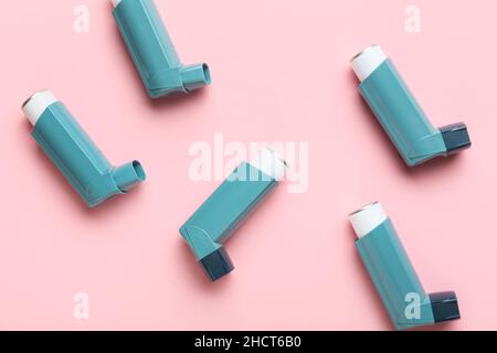 Modern asthma inhalers on color background Stock Photo - Alamy