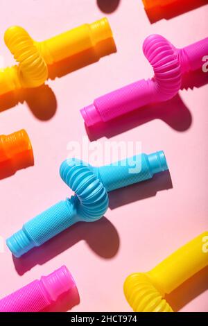 Pop Tubes on pink background. Banner for design Stock Photo - Alamy