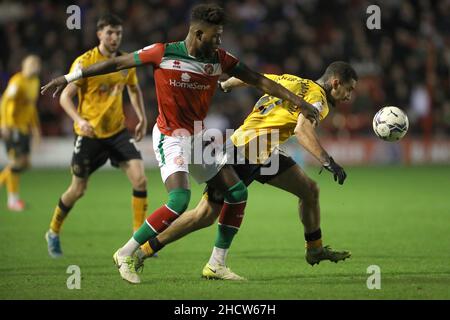 9, Courtney Baker-Richardson of Newport County signs an autograph as he leaves the field ...