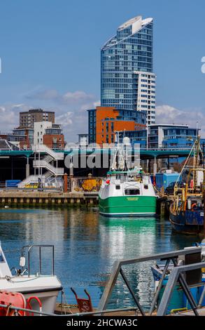 Fishing boat moored in the Camber dock with the Spinnaker tower in ...
