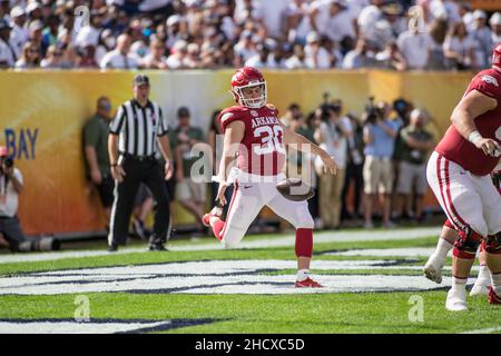January 1, 2022: Arkansas Razorbacks punter Reid Bauer (30) punts from ...