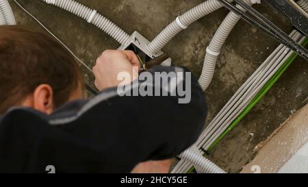close up of builder or electrician running wires Stock Photo - Alamy