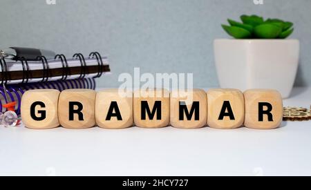 the word grammar wooden cubes with burnt letters, study of grammar of ...