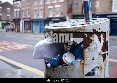 Bin overflowing with rubbish Liverpool city centre Stock Photo - Alamy