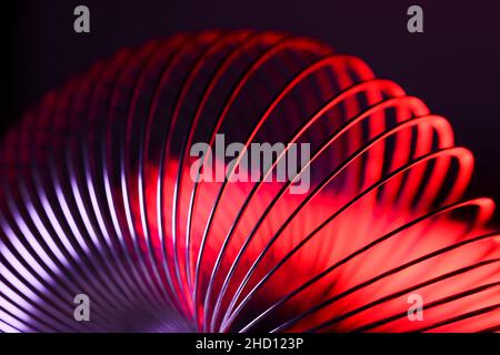 Closeup of coiled metal spring with sufficiently high strength and ...