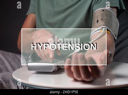 Hypotension word, low blood pressure concept Stock Photo - Alamy